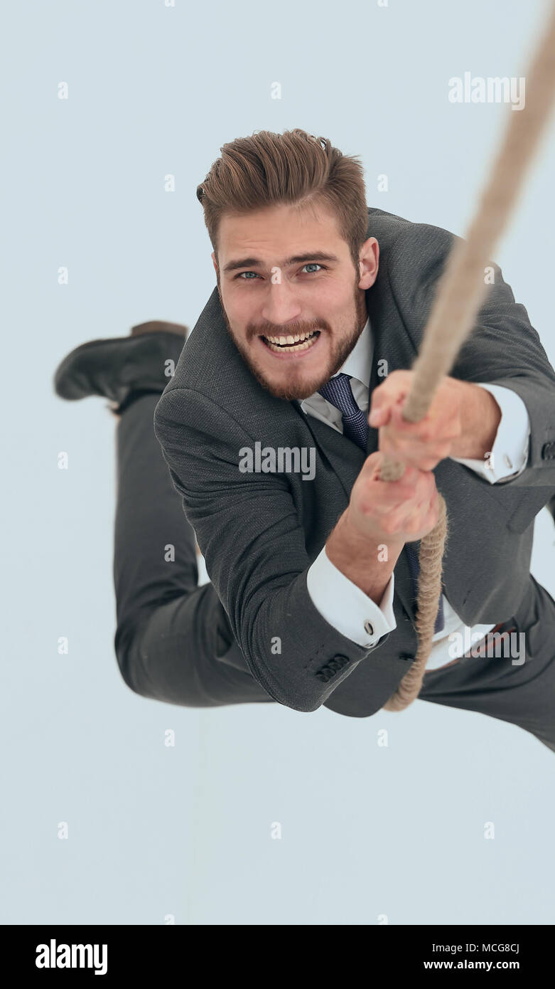 successful businessman climbing the rope Stock Photo - Alamy