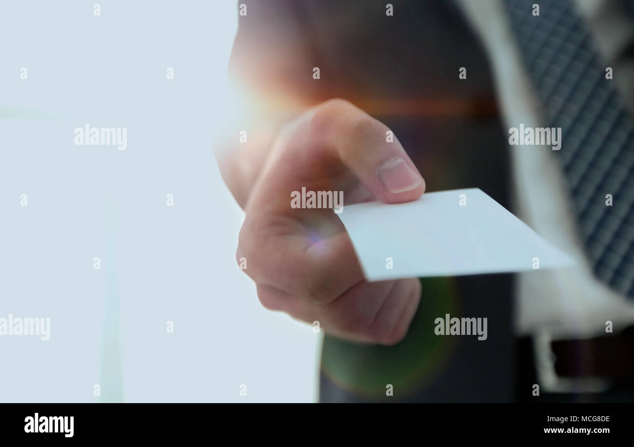 Business man giving business card on bright background Stock Photo - Alamy