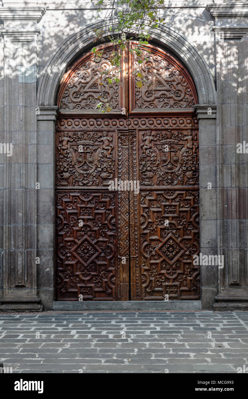 Carved wooden door catholic church hi-res stock photography and images ...