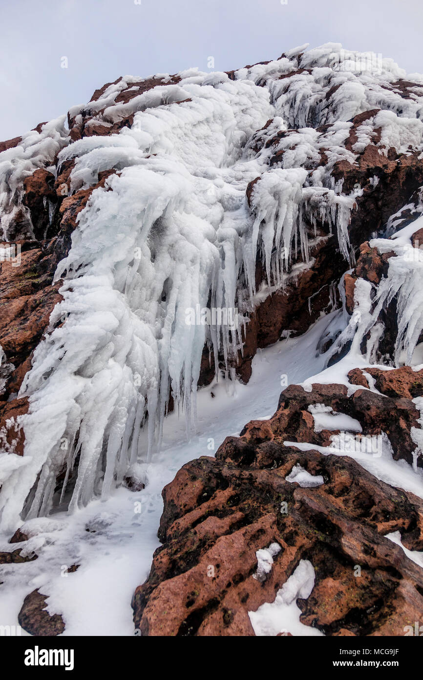 Ice stalactites on volcanic rocks, Cayambe volcano, Ecuador Stock Photo ...