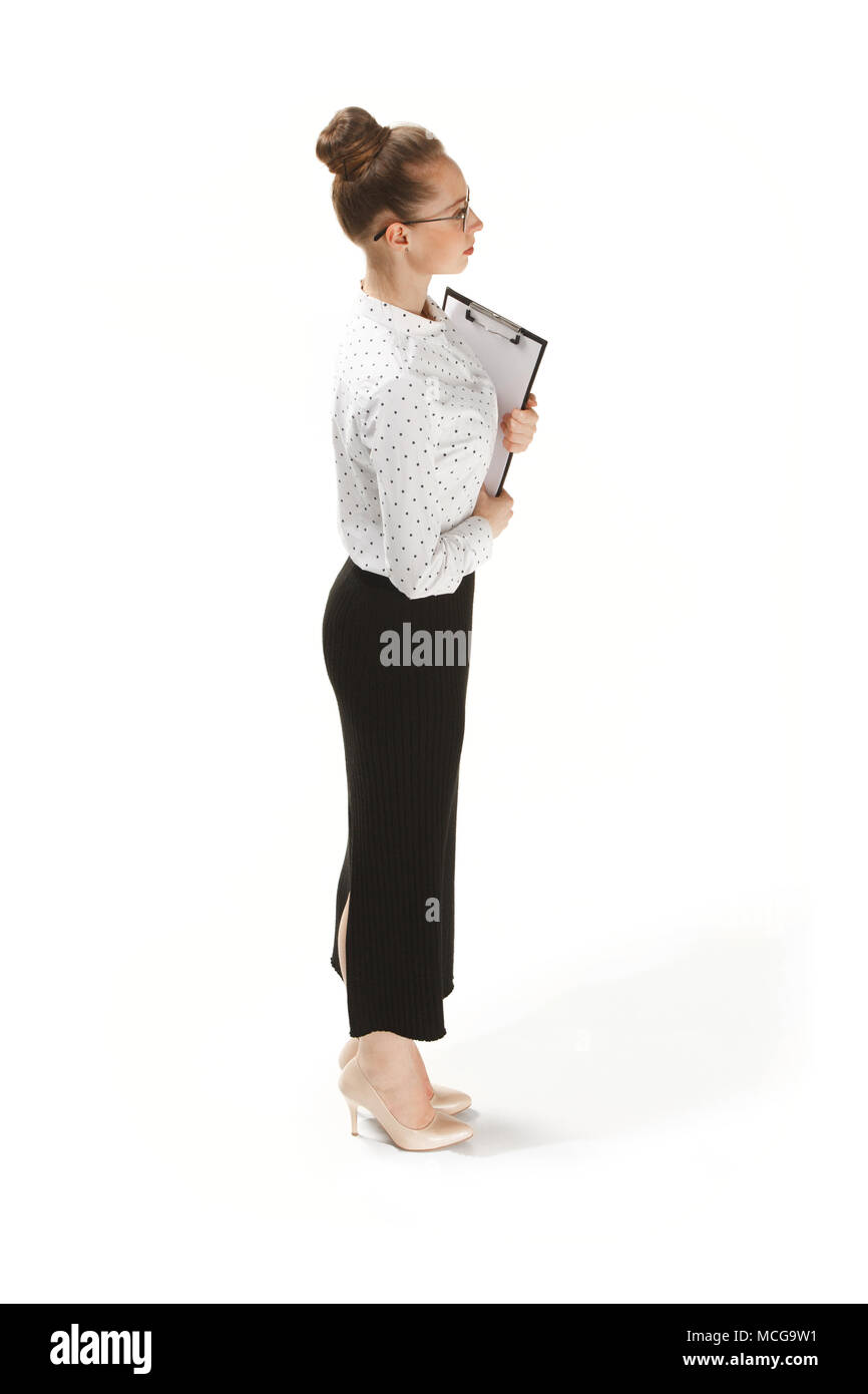 Full length portrait of female teacher holding a folder isolated ...