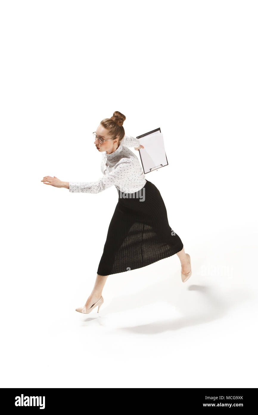 Full length portrait of a smiling female teacher holding a folder ...
