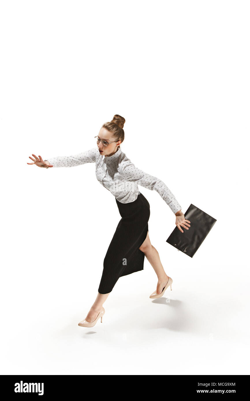 Full length portrait of a smiling female teacher holding a folder ...