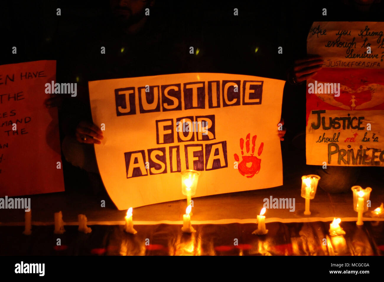 Srinagar, Jammu and Kashmir, India. 16th Apr, 2018. Youth hold candles ...