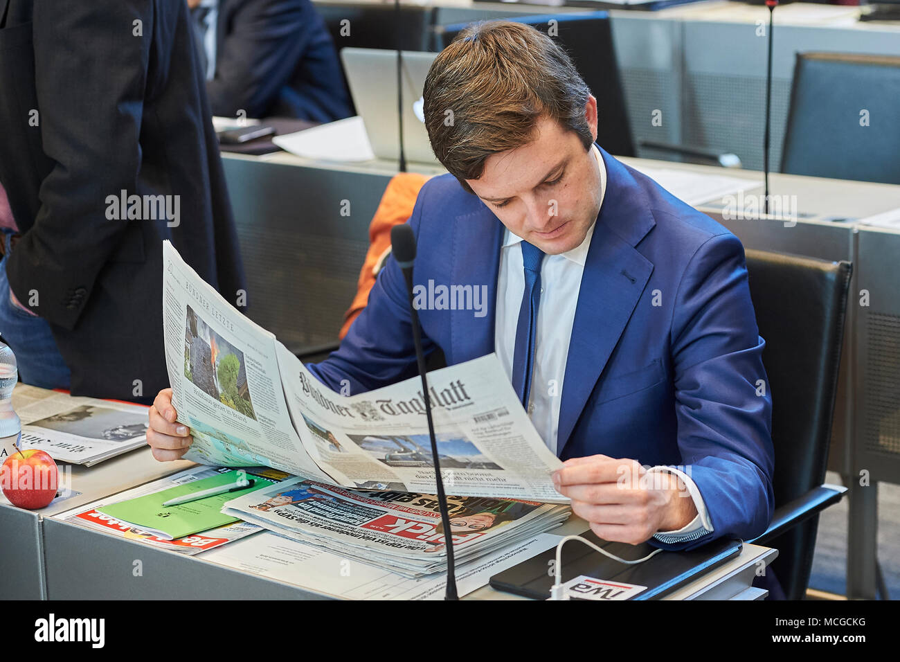 Chur, Switzerland, 16th April 2018. Jon Pult reading the newspaper ...