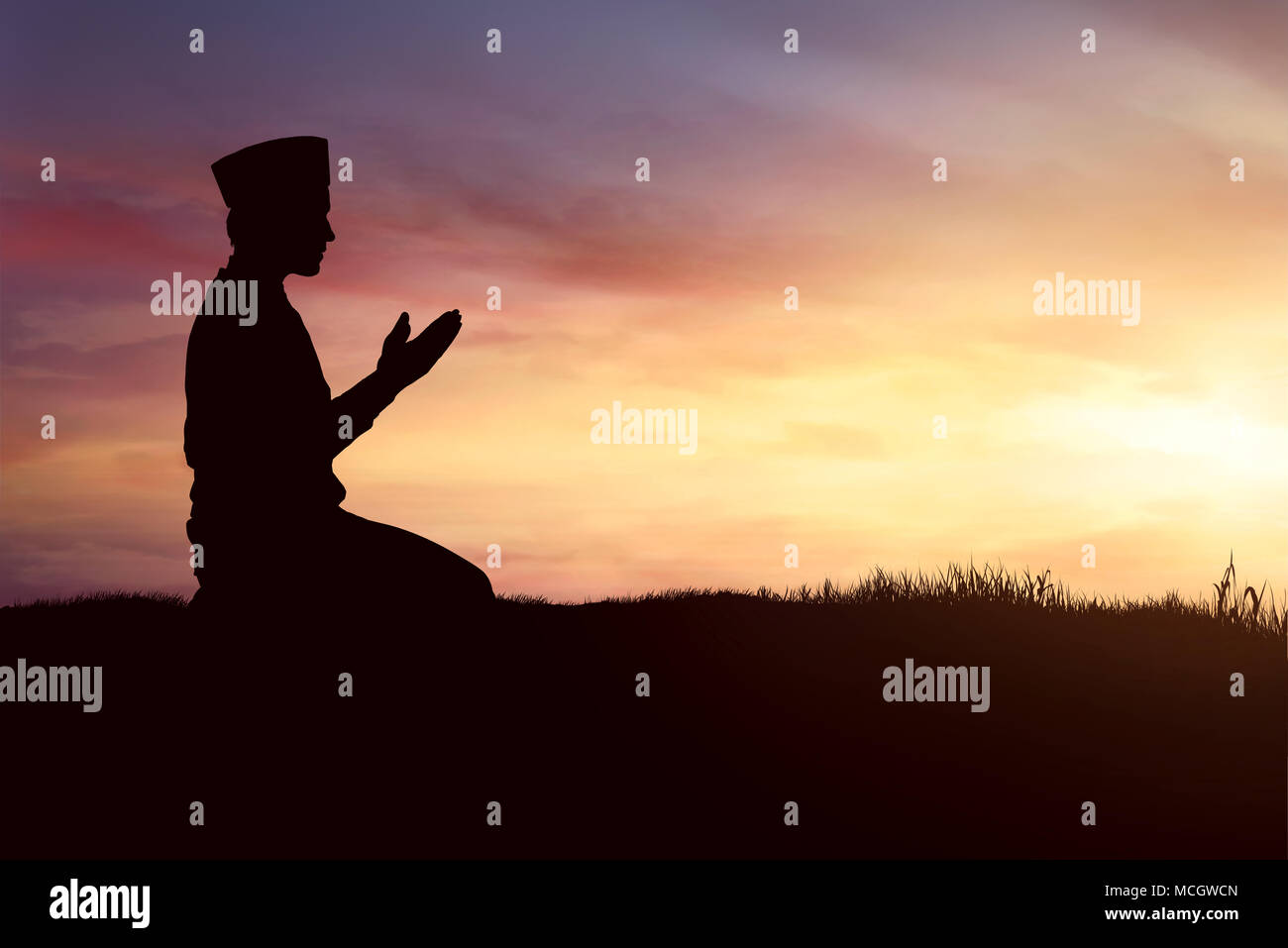 Silhouette of muslim man praying during sunset Stock Photo - Alamy