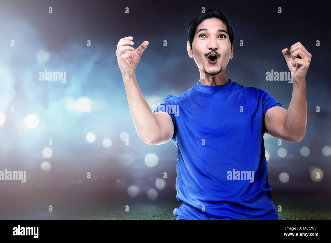 Professional soccer player man with excited expression on the field ...