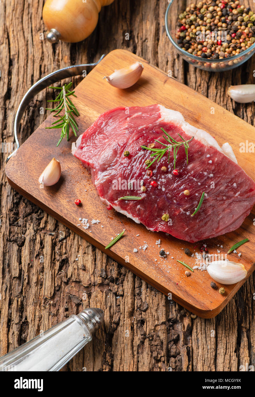 prepare fresh beef with salt garlic and rosemary leaf for beef steak on ...