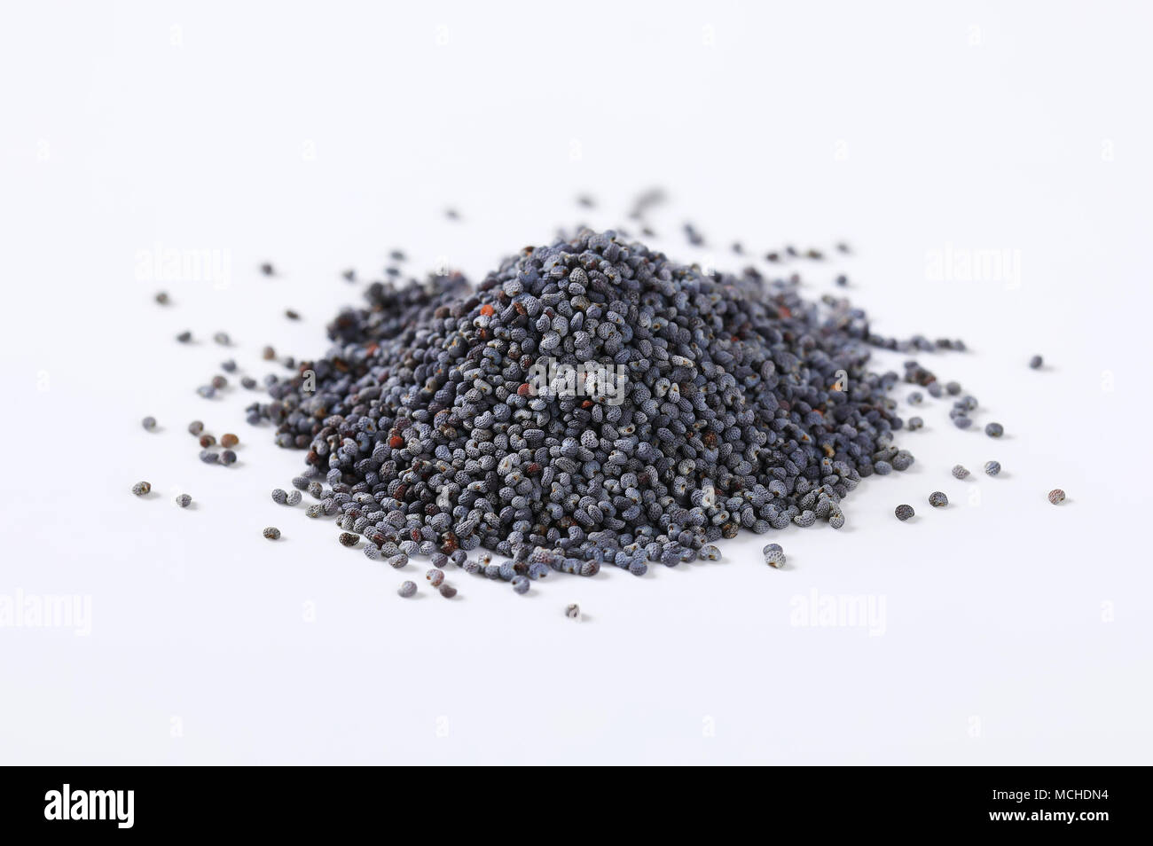 pile of poppy seeds on white background Stock Photo - Alamy
