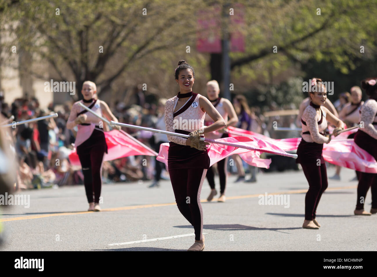 Washington, D.C., USA - April 14, 2018 Cheerleaders dancing with pink ...