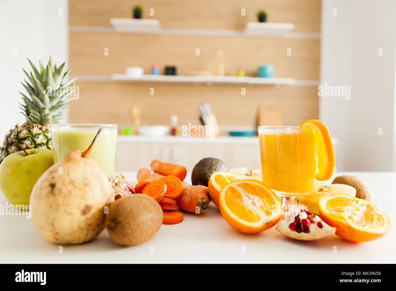 Organic fruits and vegetables on the table at the kitchen Stock Photo ...