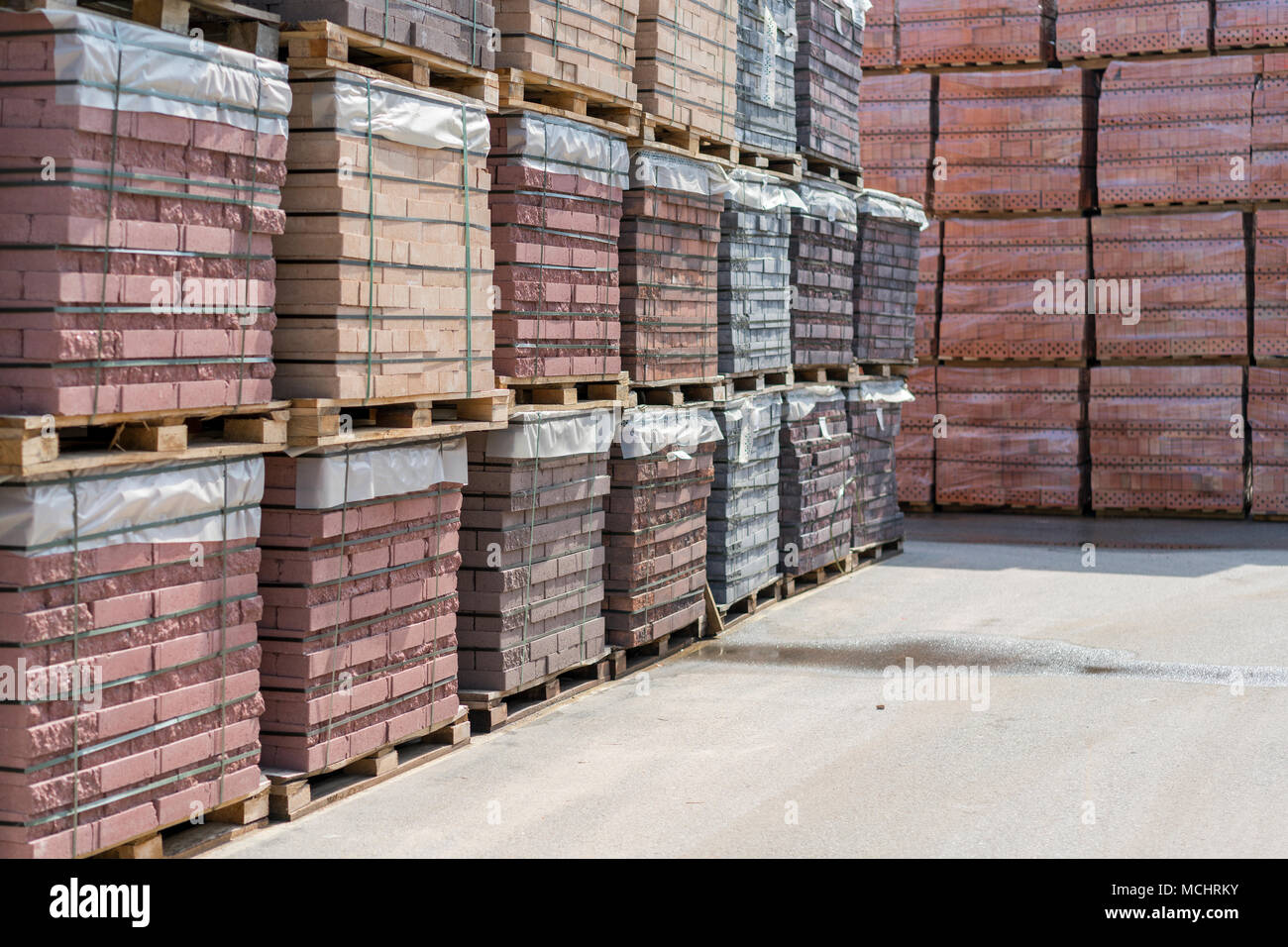pallets with bricks in the building store. Racks with brick. Masonry ...