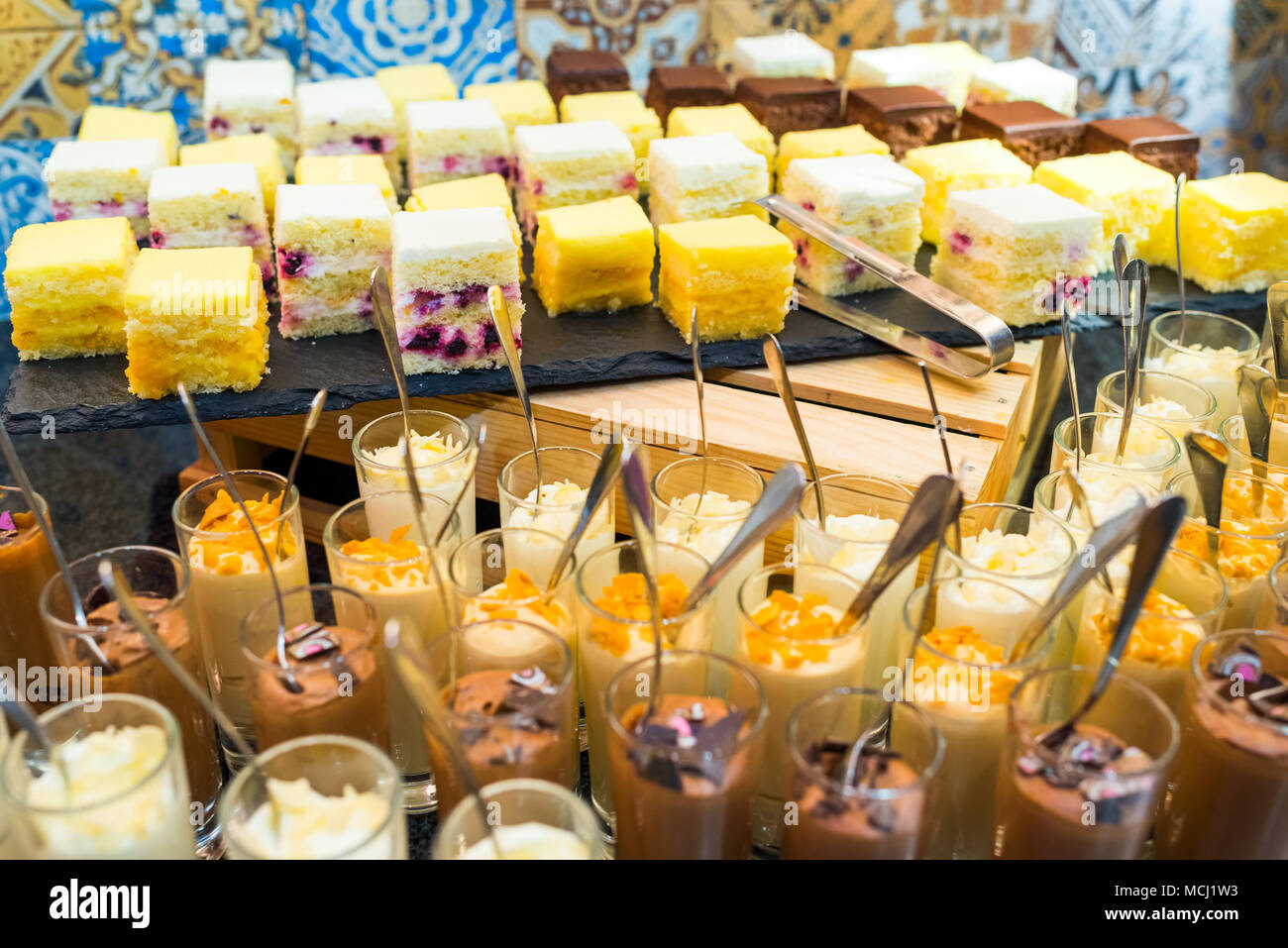 sweet table with desserts and mousses and cakes Stock Photo - Alamy