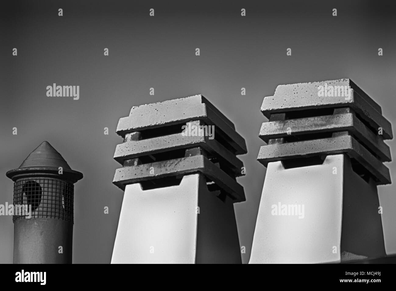 Stone square chimney on the roof in sunny weather Stock Photo - Alamy