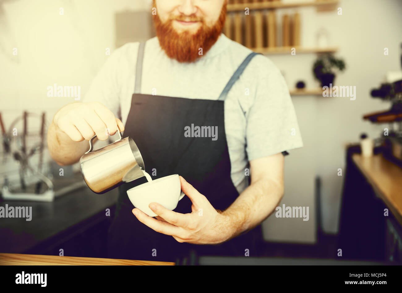 Coffee Business Concept - handsome bearded man in apron making coffee ...