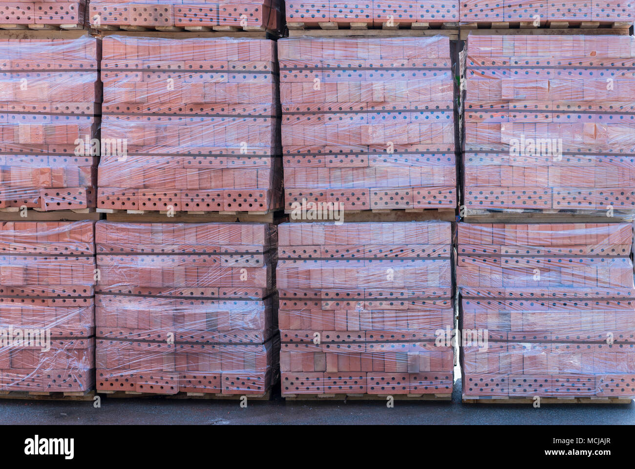 Clay brick's pallet at the storage yard. pallets with bricks in the ...