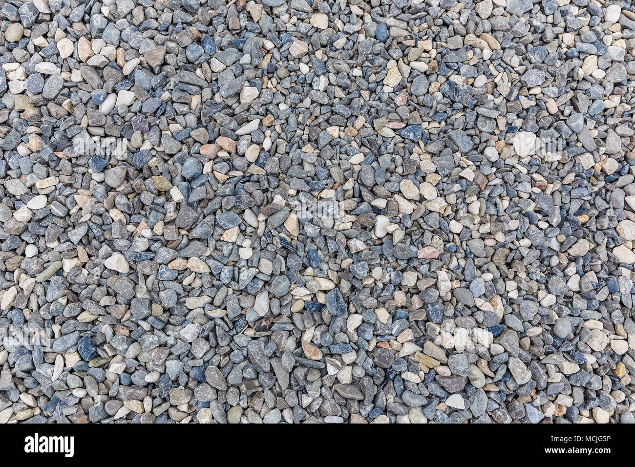 Texture of small pebbles on the floor Stock Photo - Alamy
