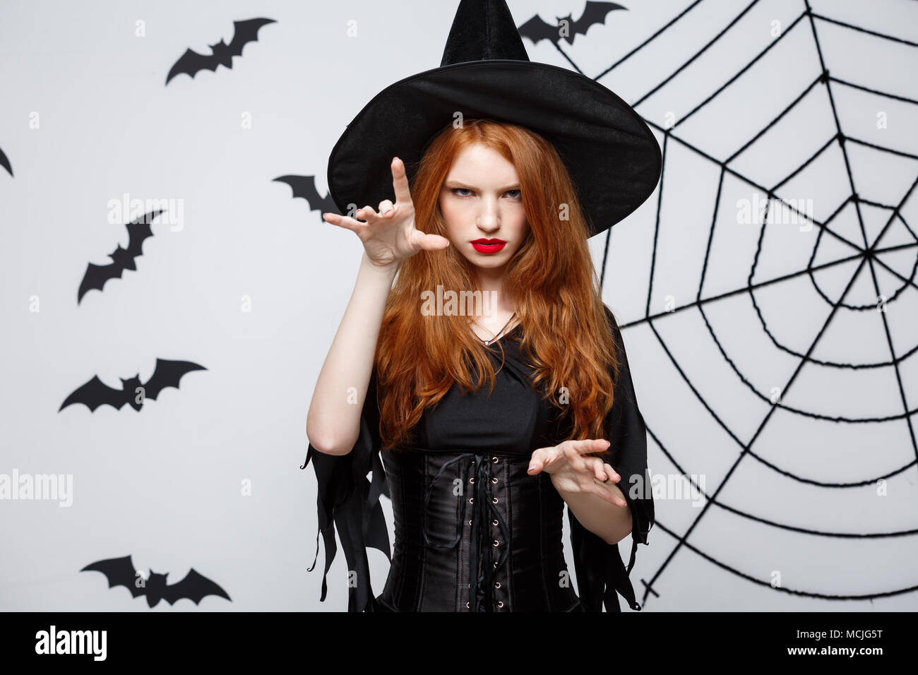 Halloween witch concept - Full-length Halloween Witch casting spells ...