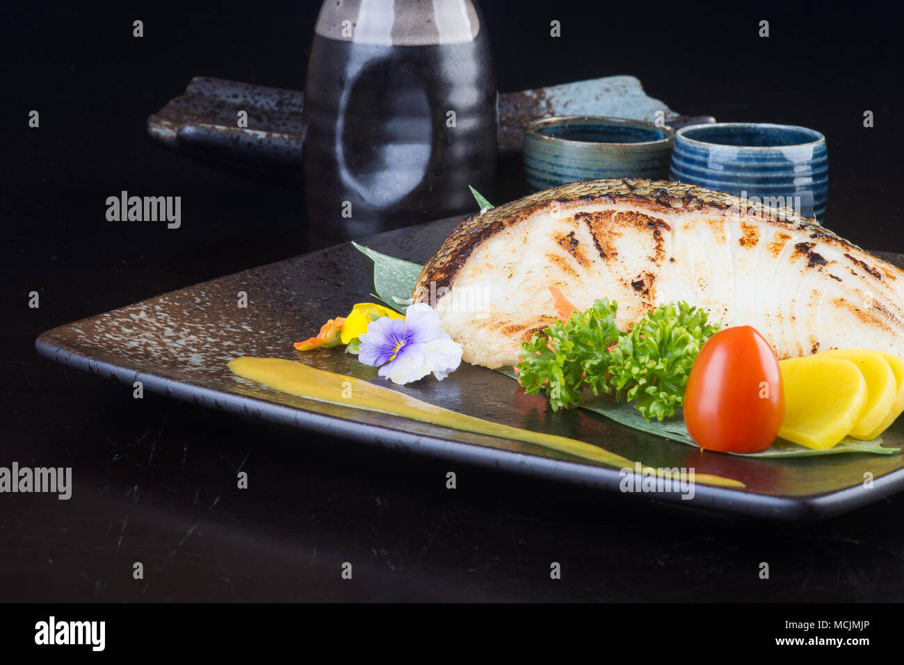 japanese cuisine. fried fish on background Stock Photo - Alamy