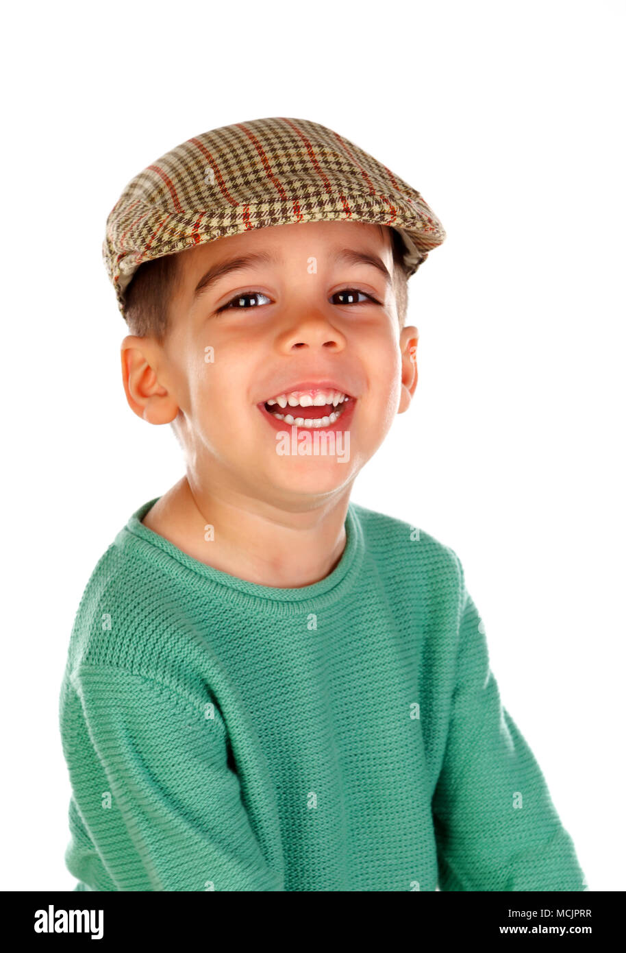 Funny small child with dark eyes and spanish cap isolated on a white ...