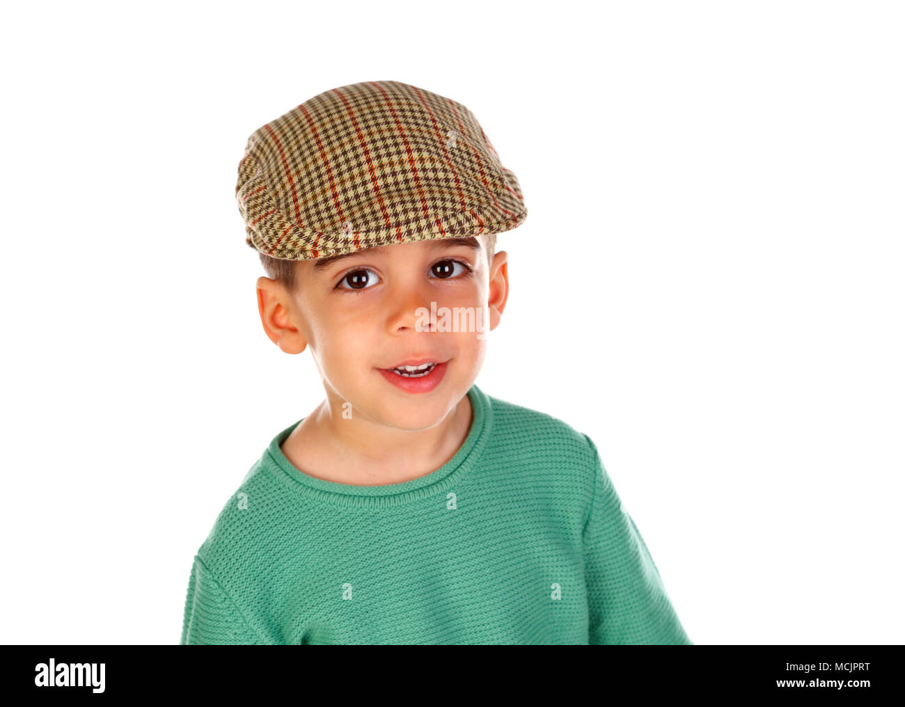 Funny small child with dark eyes and spanish cap isolated on a white ...