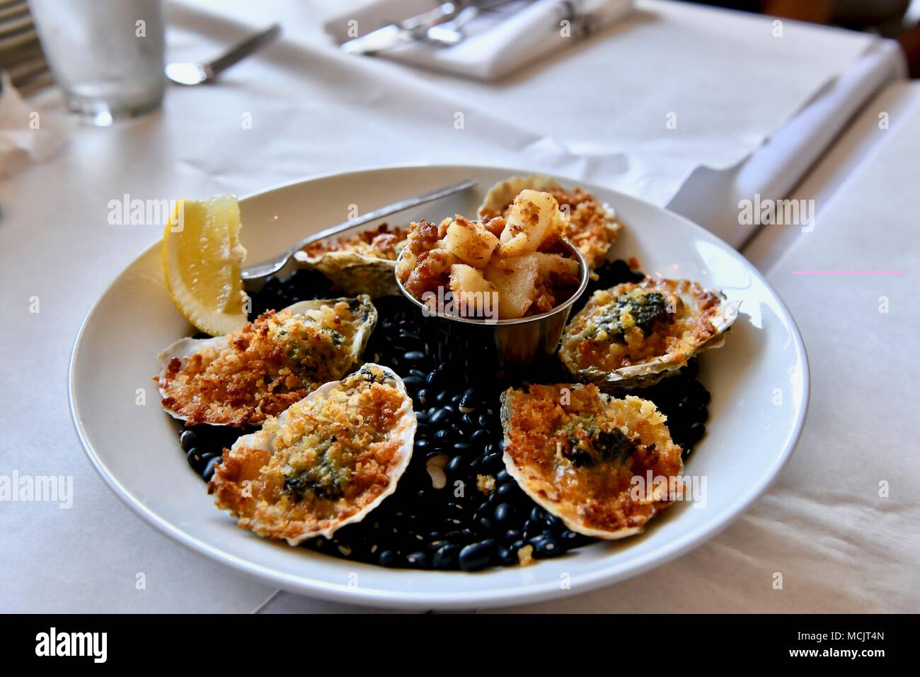 Oysters Rockefeller appetizer served at a seafood restaurant, USA Stock ...