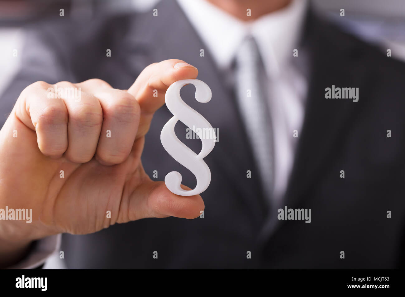 Close-up Of A Businessperson's Hand Holding Paragraph Symbol Stock ...