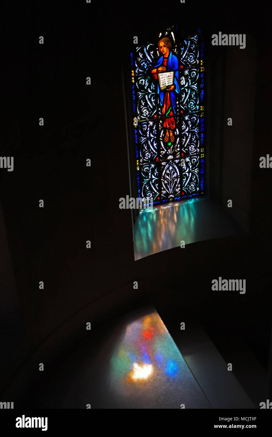 Light shinning through a stained glass window creating a rainbow on the ...