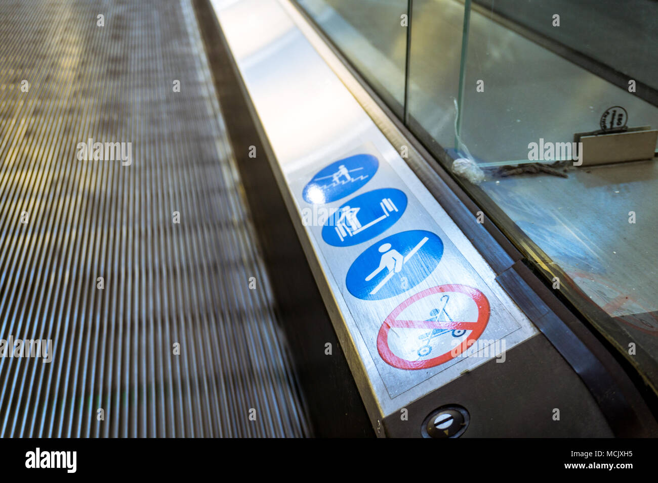 Restriction signs on a conveyor belt. Restictions on a conveyor belt ...