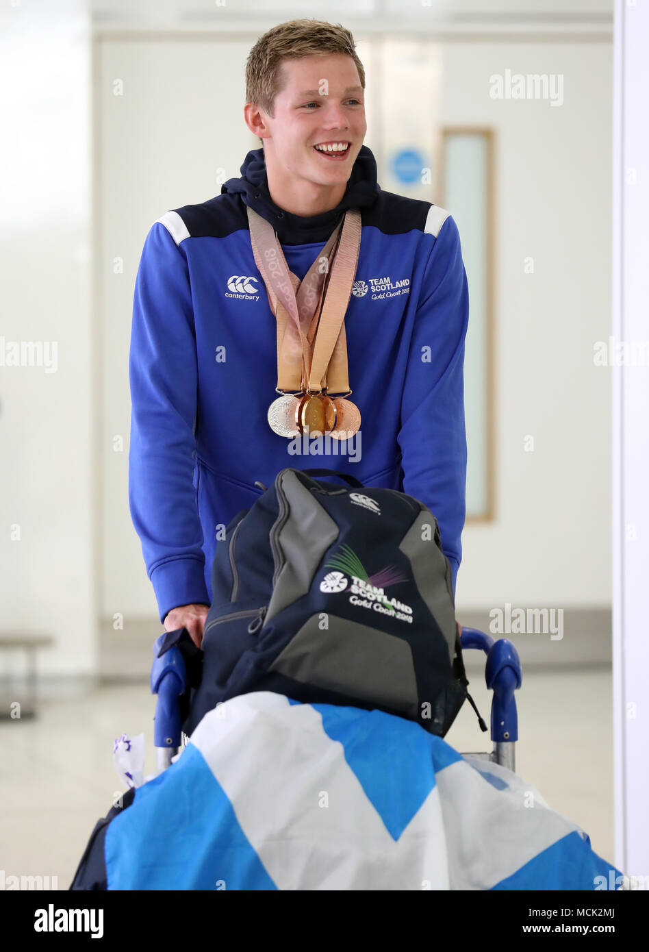 Swimmer Duncan Scott arrives at Glasgow Airport following the ...