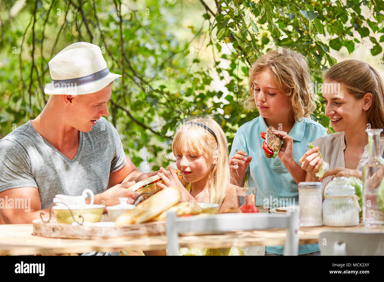 Happy family and children have breakfast together in the morning in the ...