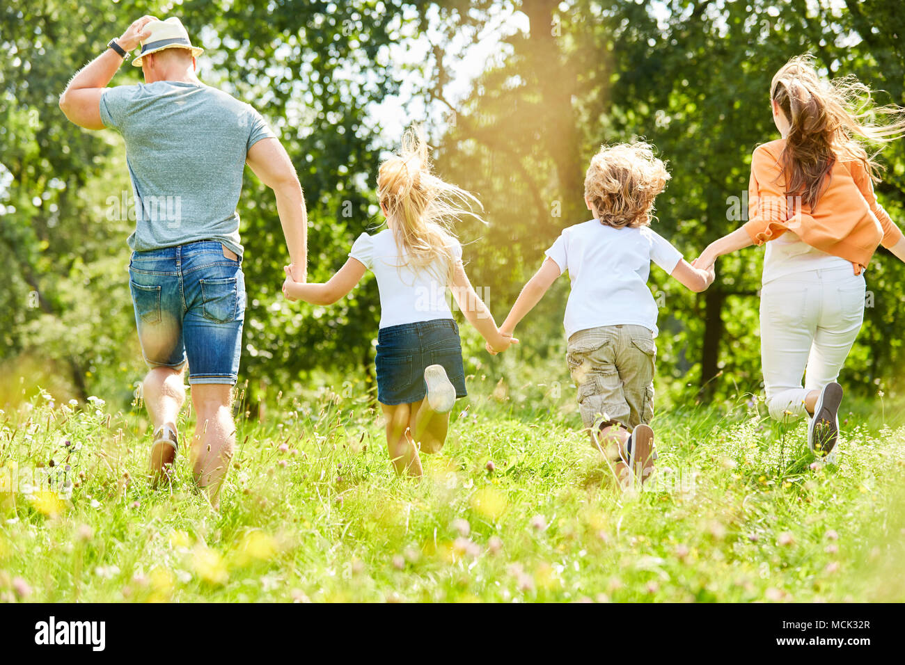 Happy children run across park hi-res stock photography and images - Alamy