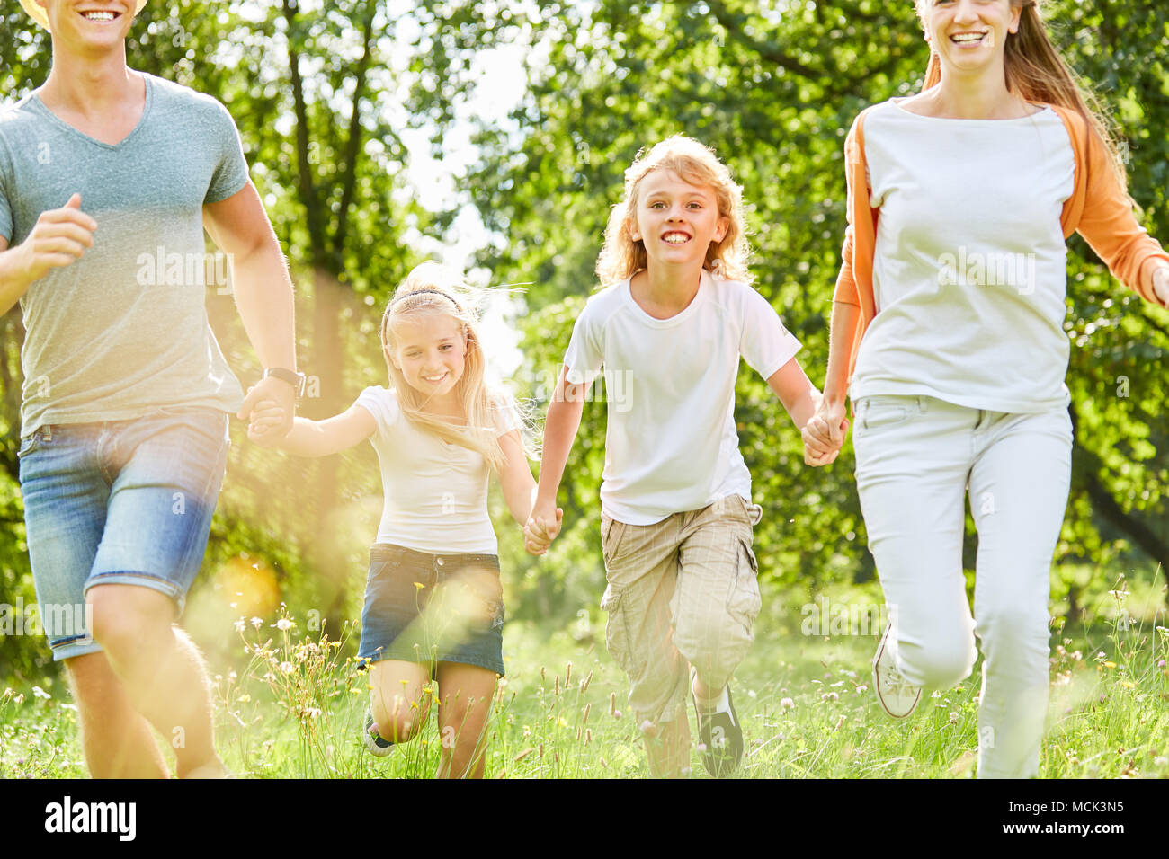 Boy and girl running together hi-res stock photography and images - Alamy