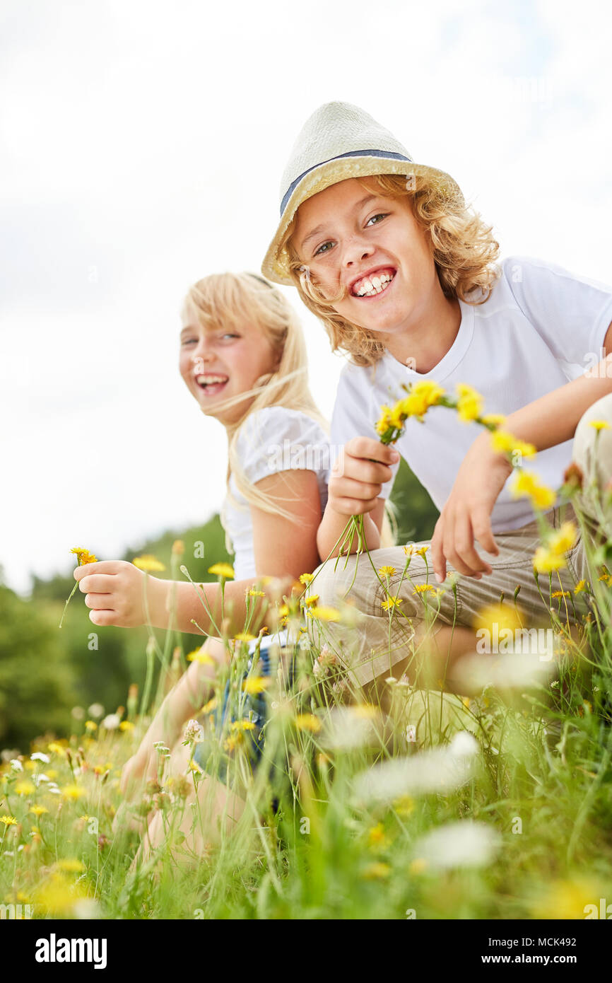 Children picking flowers hi-res stock photography and images - Alamy