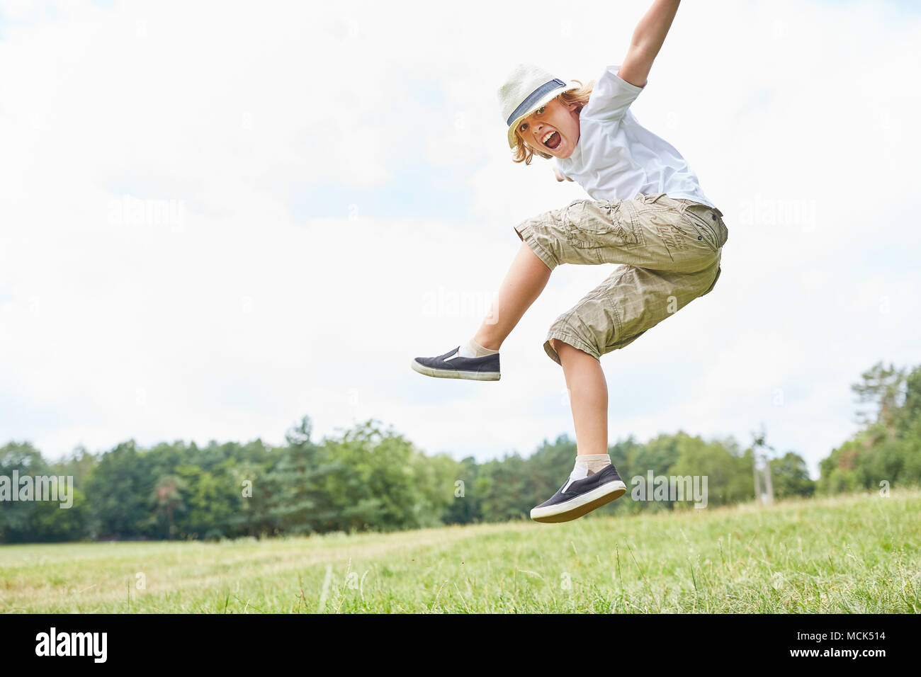 Boy jumps on a meadow hi-res stock photography and images - Alamy