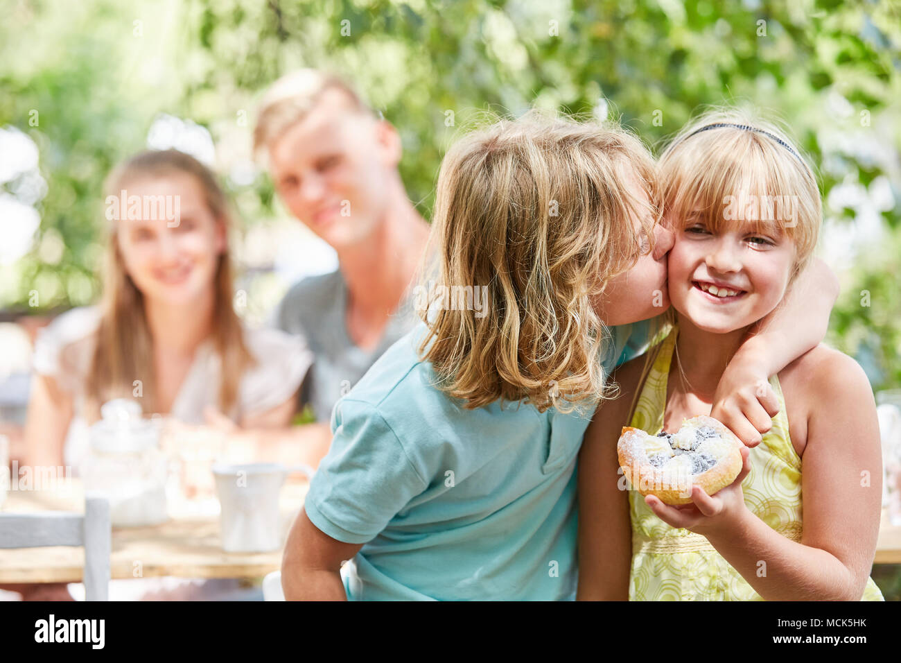 Boy kiss girl cheek hi-res stock photography and images - Alamy