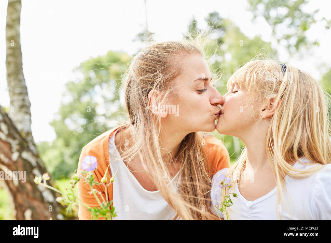 Mother kiss daughter hi-res stock photography and images - Alamy