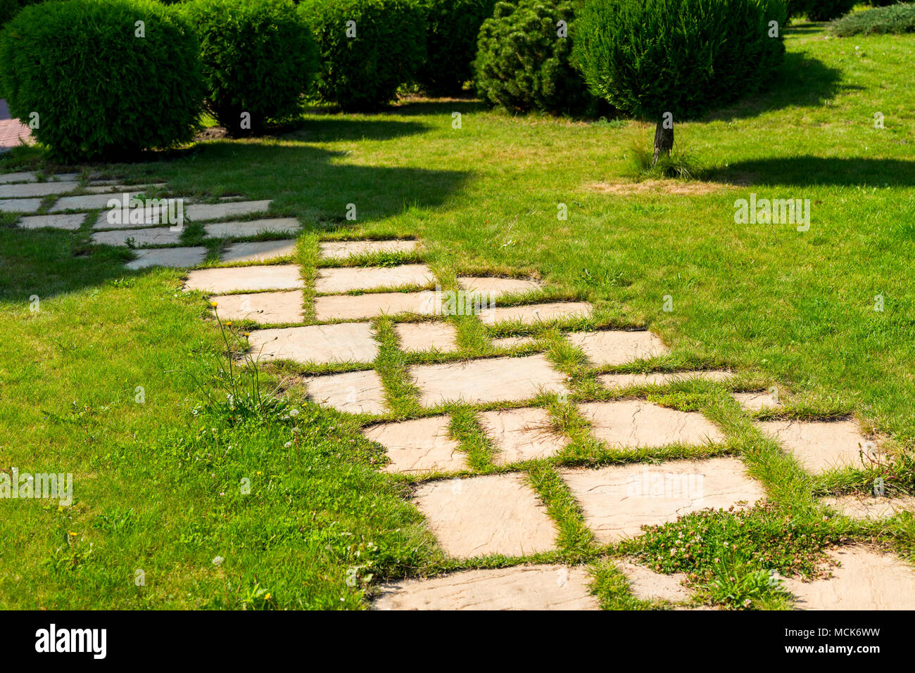 decorated stone paths in landscape design Stock Photo - Alamy