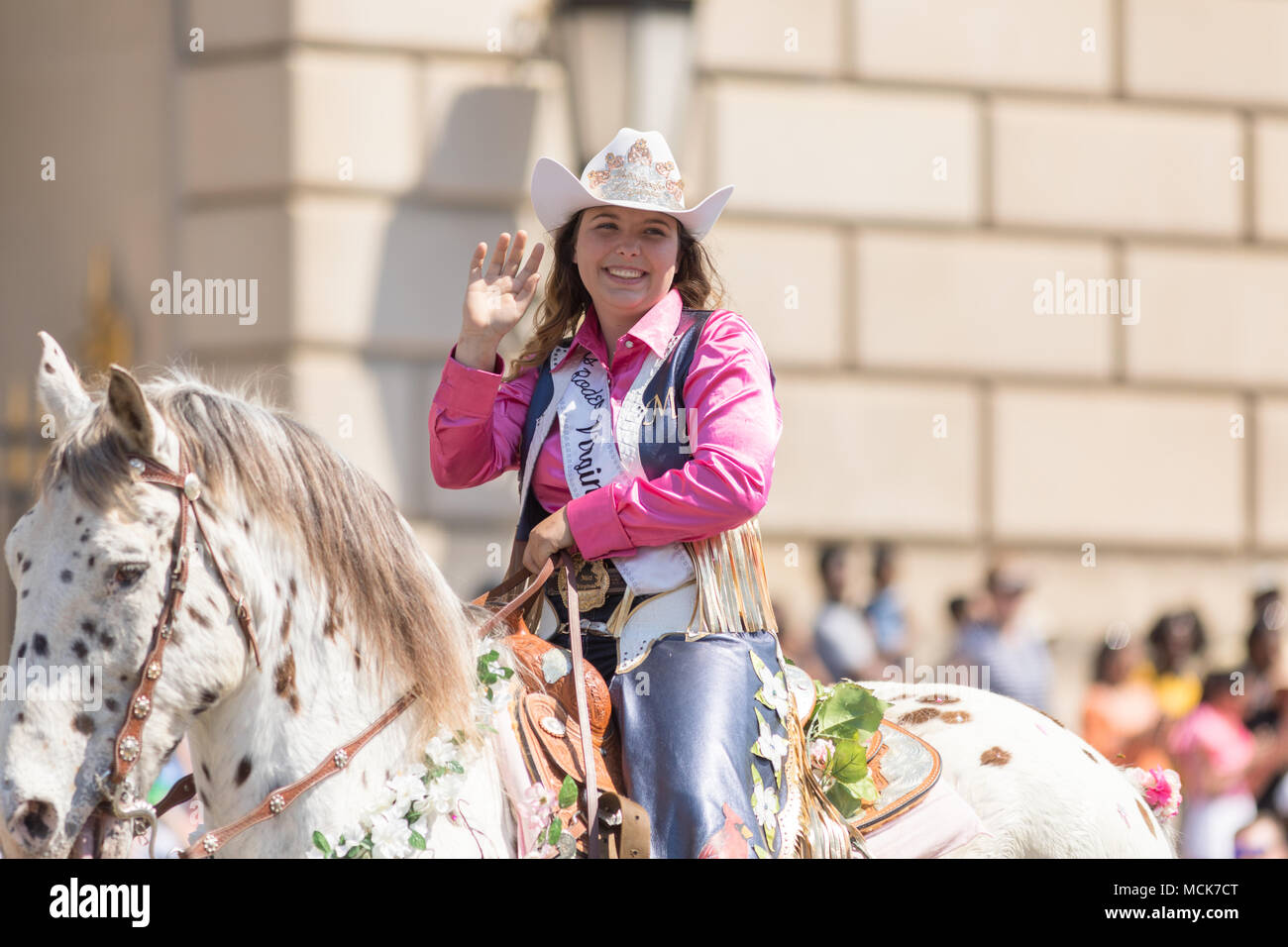 Washington, D.C., USA - April 14, 2018 A woman riding a horse covered ...