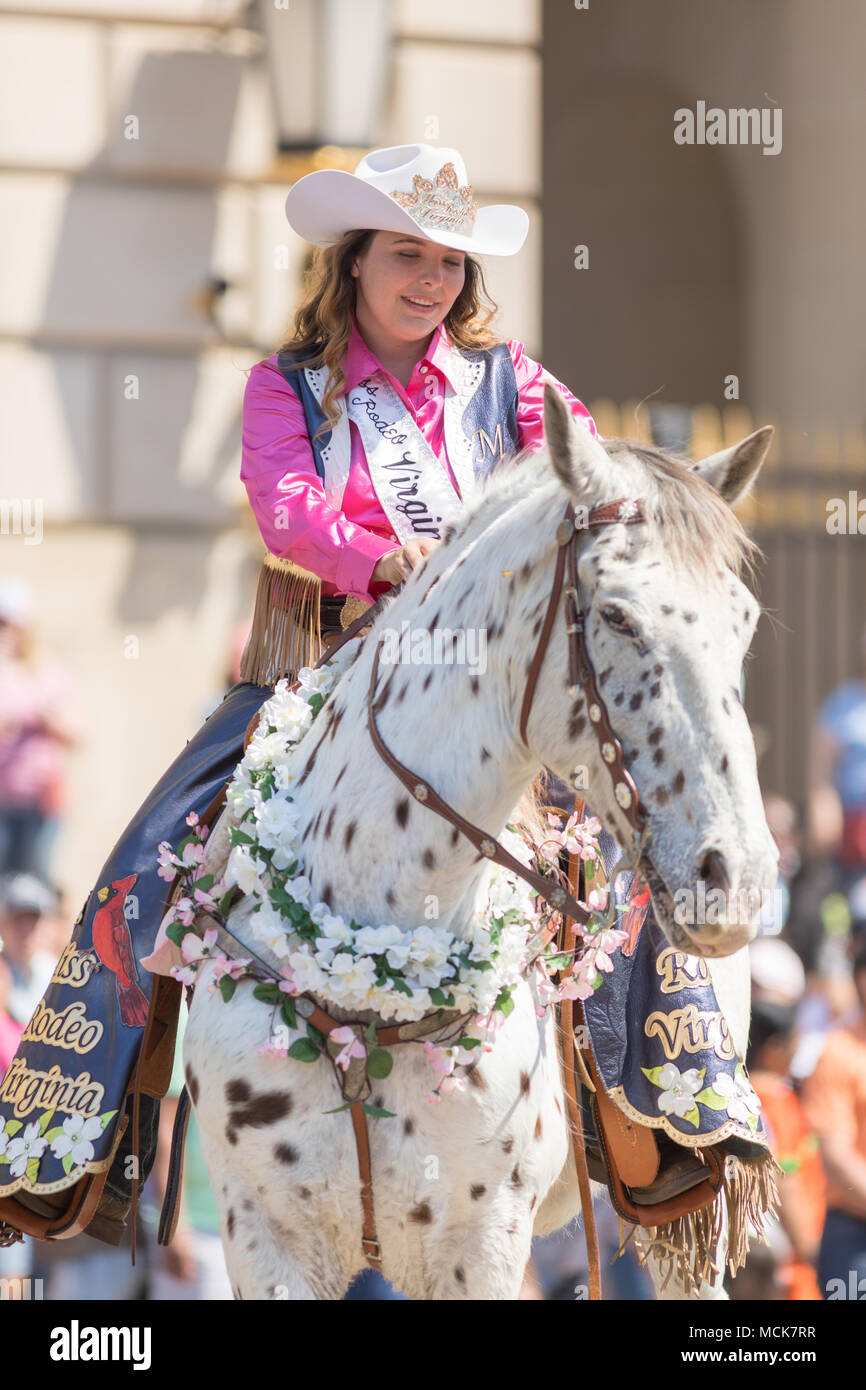Washington, D.C., USA - April 14, 2018 A woman riding a horse covered ...