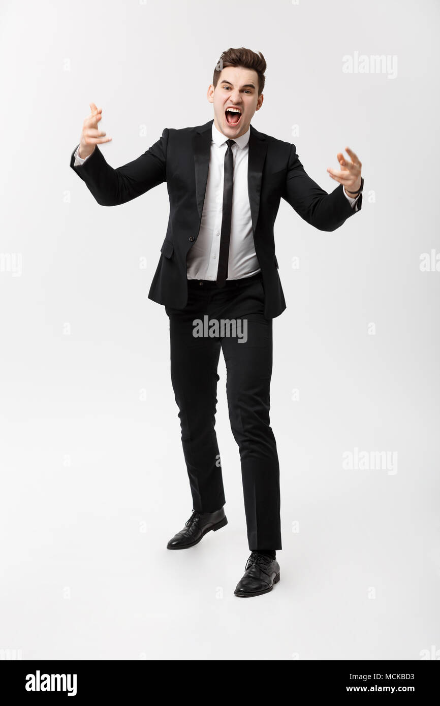 Business Concept: Full-length Portrait of a mad businessman in suit ...