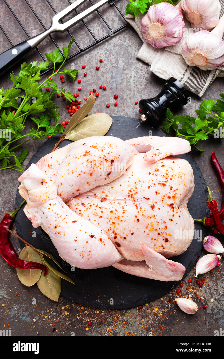 Raw chicken. Fresh whole chicken with ingredients for cooking Stock ...