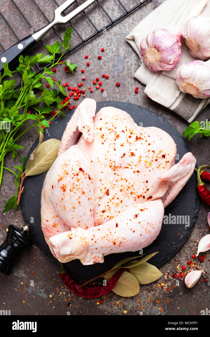 Raw chicken. Fresh whole chicken with ingredients for cooking Stock ...