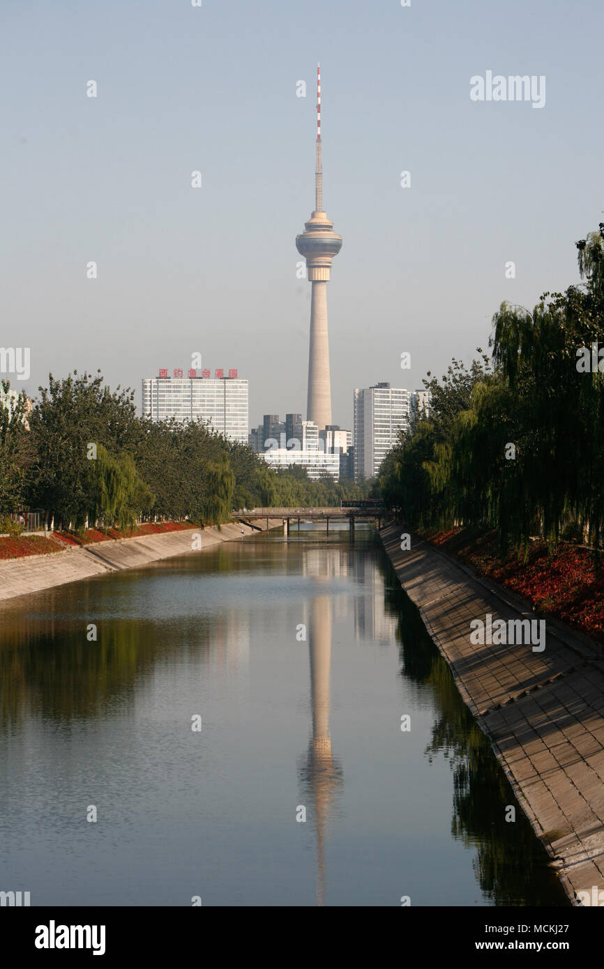 Beijing CCT Television tower rises high into sky with reflection in ...