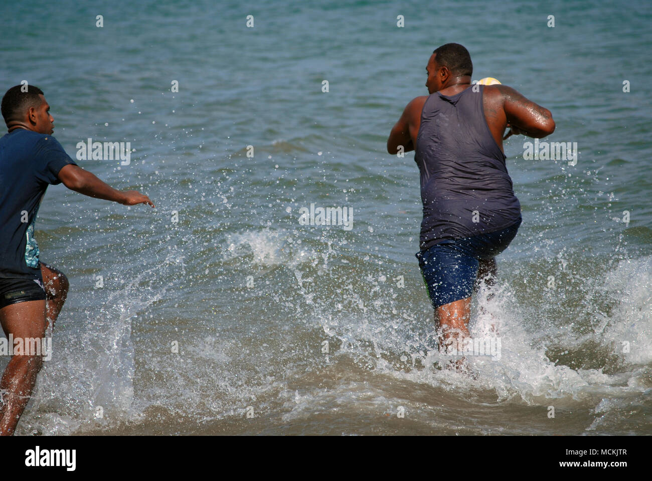Fijian men playing rugby on Palm Beach, Pacific Harbour, Fiji Stock ...
