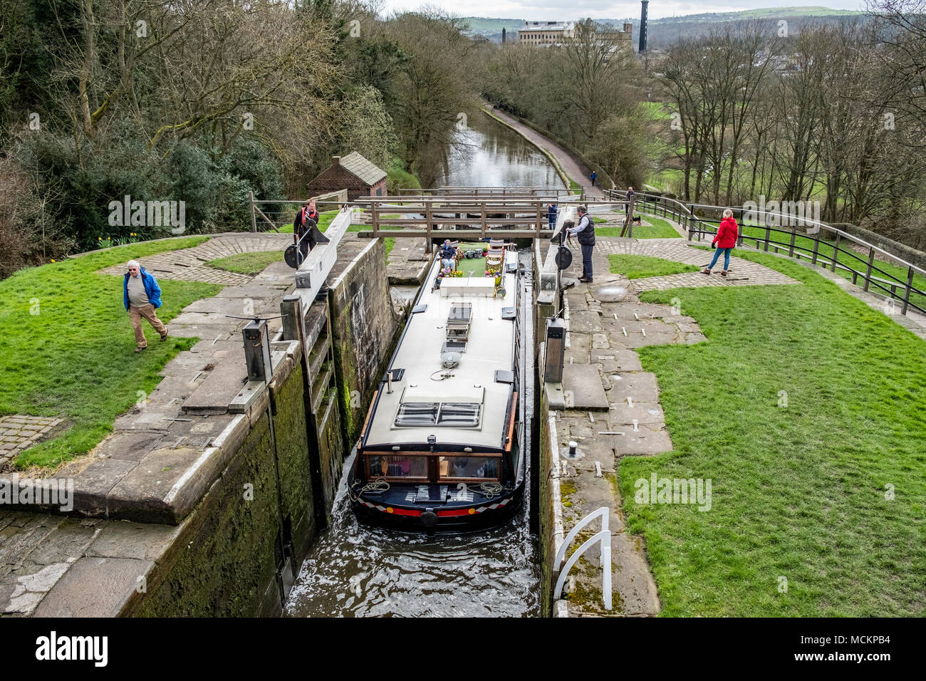 A boat negotiating The Five Rise Locks on the Leeds and Liverpool Canal ...