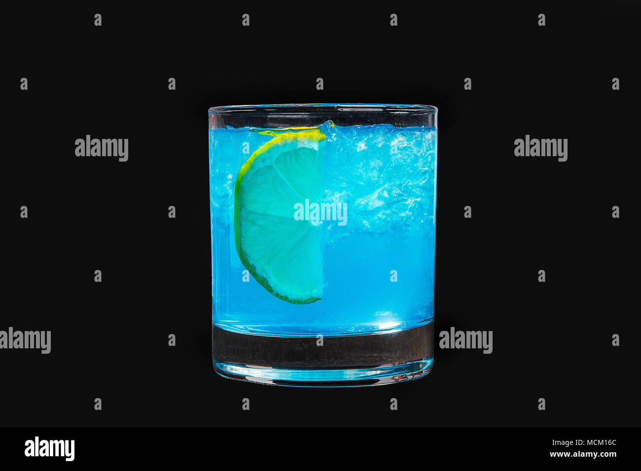 A single-colored transparent cocktail, refreshing shining in a low blue ...