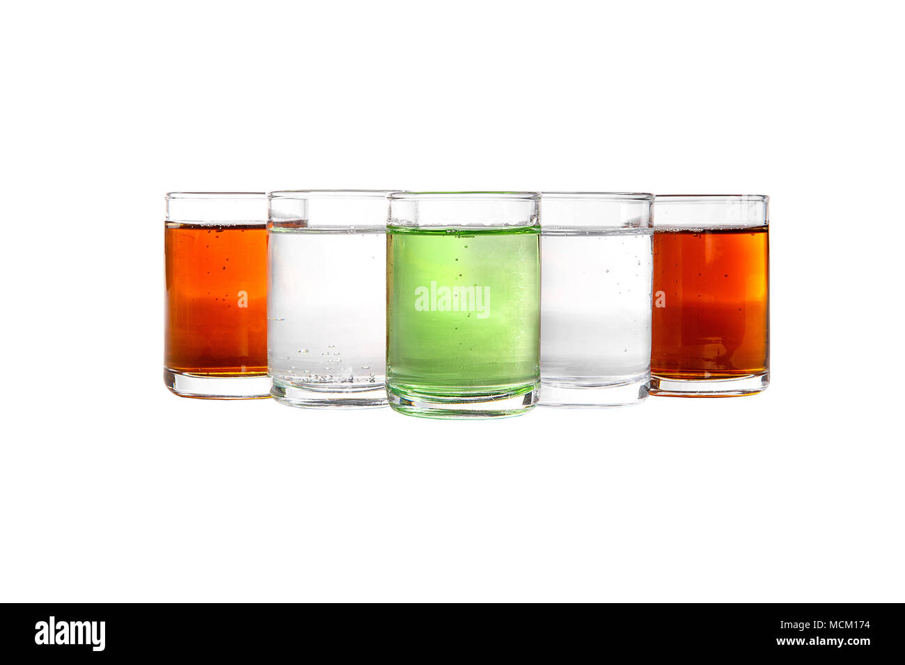 Multicolored transparent cocktails, a set of shots in a heap, a wedge ...