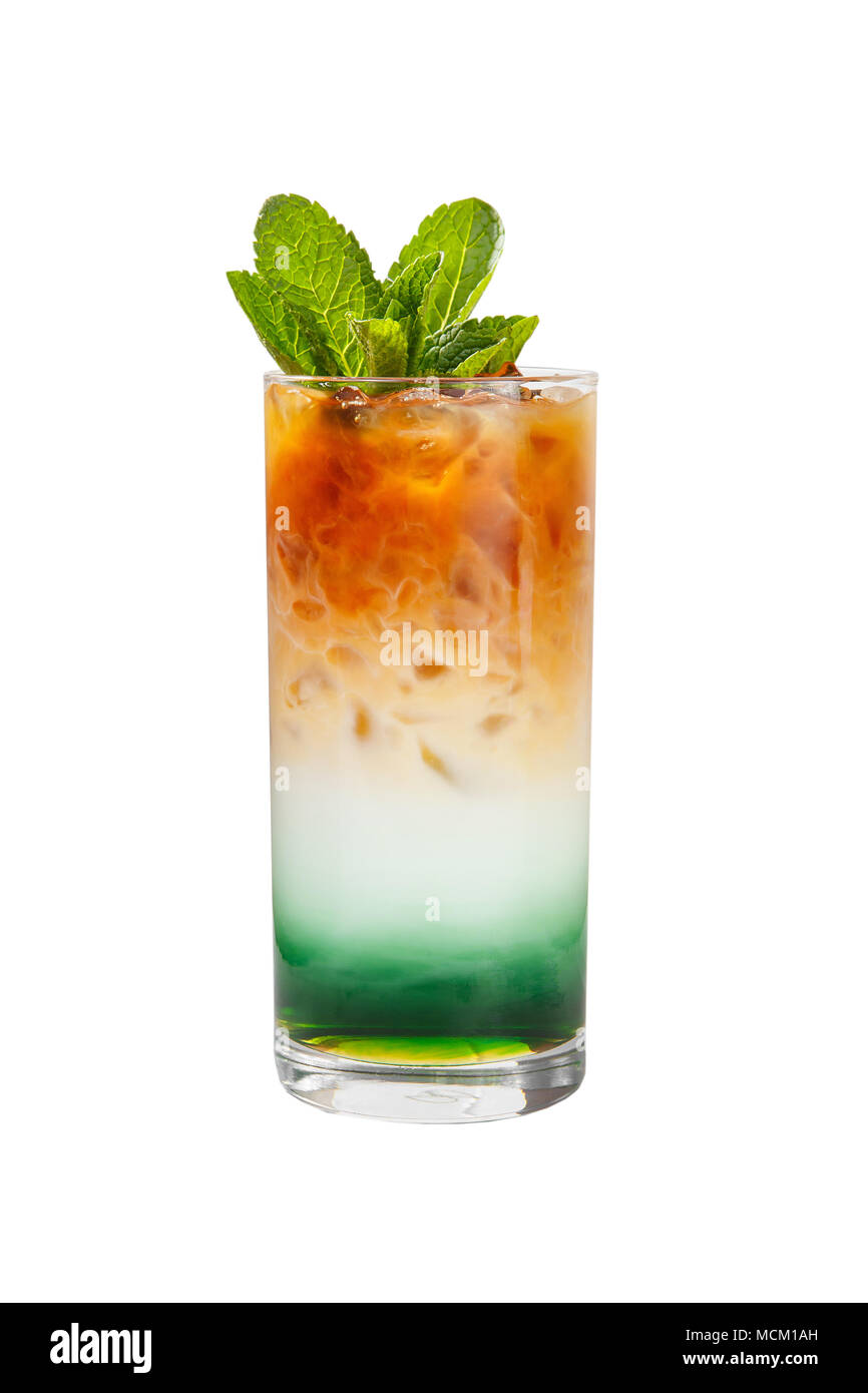 A multicolored, three-layered opaque cocktail in a tall glass with ...