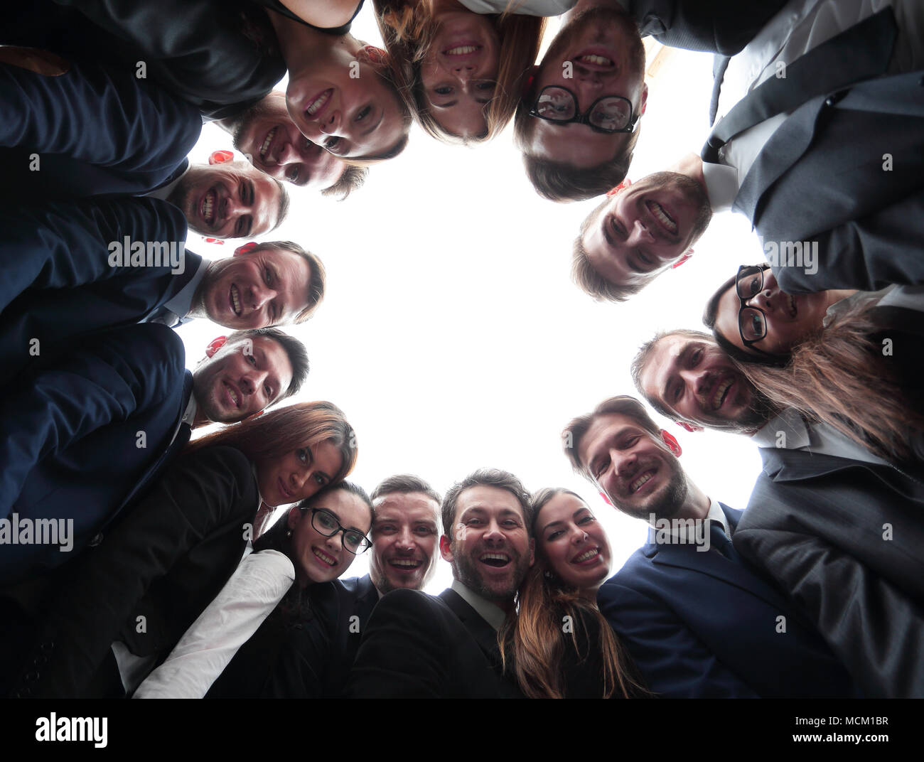 large business team is forming a circle and looking at the camera Stock ...